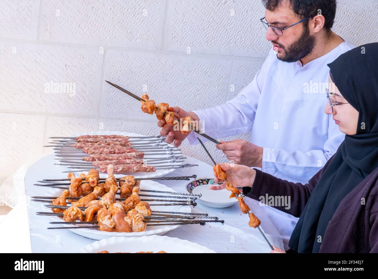 Arabic Muslim family preparing for barbeque Stock Photo - Alamy