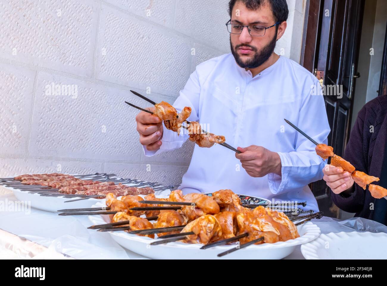 Arabic Muslim family preparing for barbeque Stock Photo - Alamy