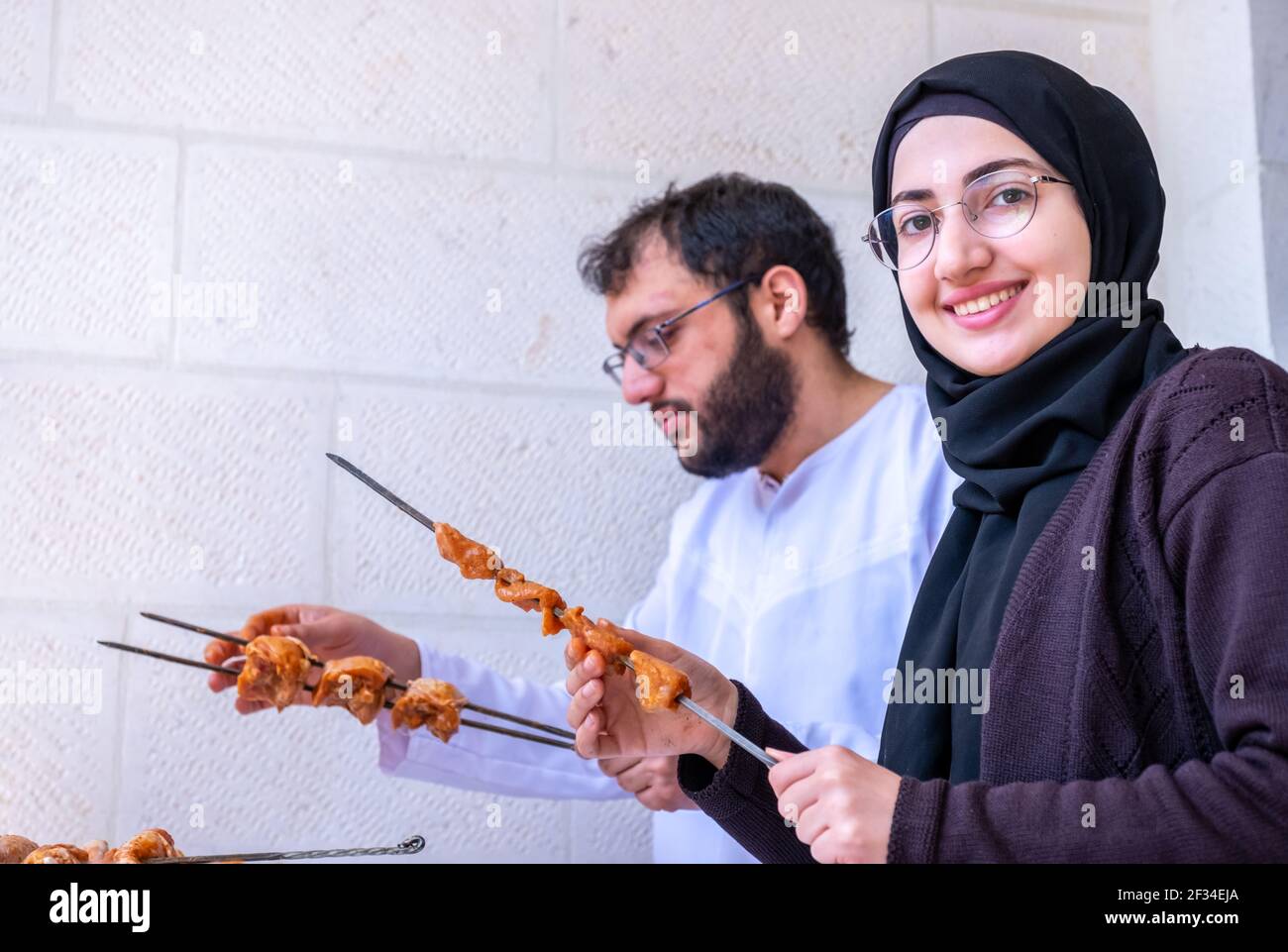 Arabic Muslim family preparing for barbeque Stock Photo - Alamy