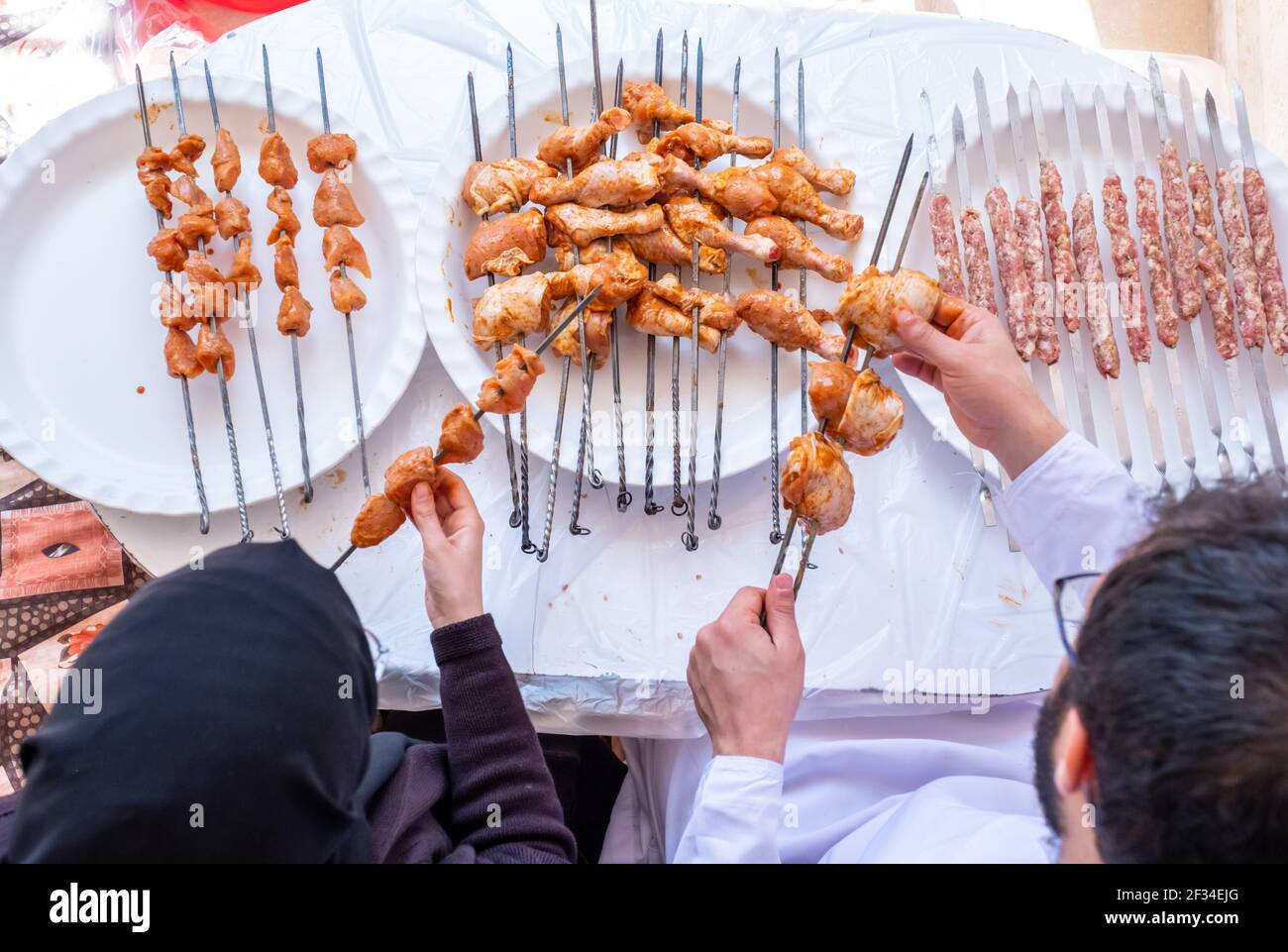 Arabic Muslim family preparing for barbeque Stock Photo - Alamy