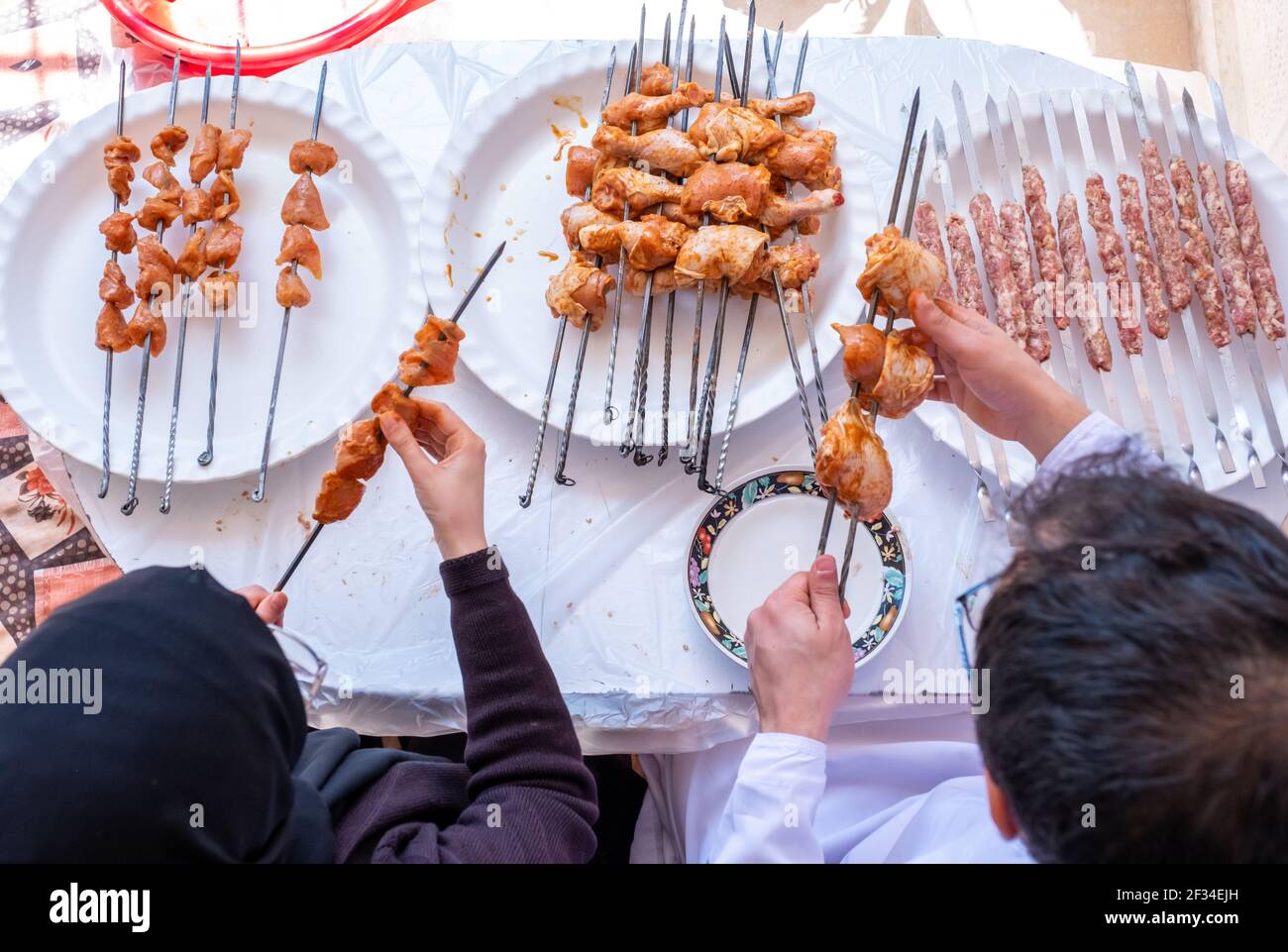 Arabic Muslim family preparing for barbeque Stock Photo - Alamy