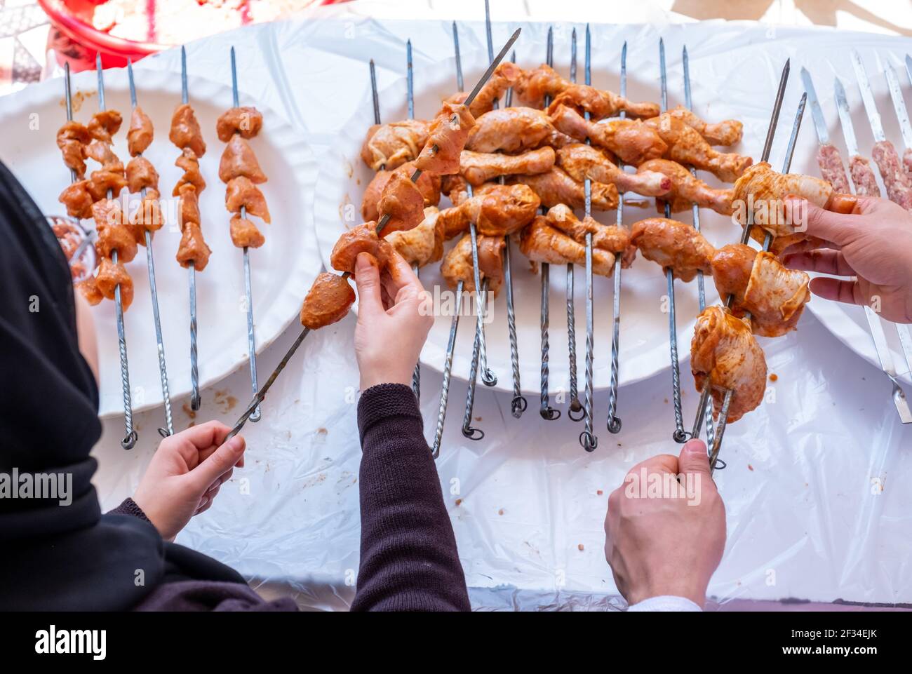 Arabic Muslim family preparing for barbeque Stock Photo - Alamy