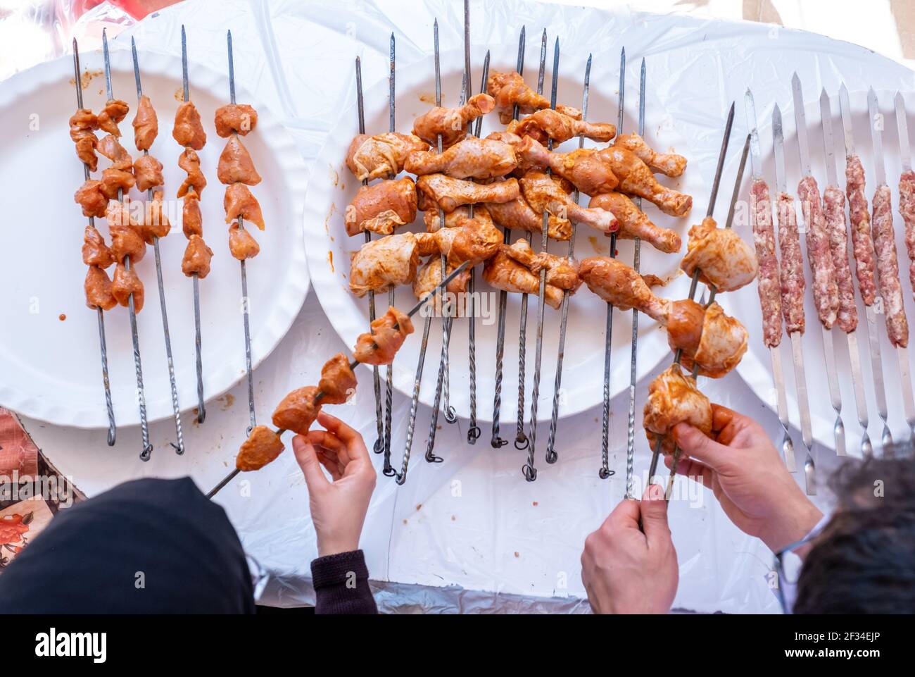 Arabic Muslim family preparing for barbeque Stock Photo - Alamy