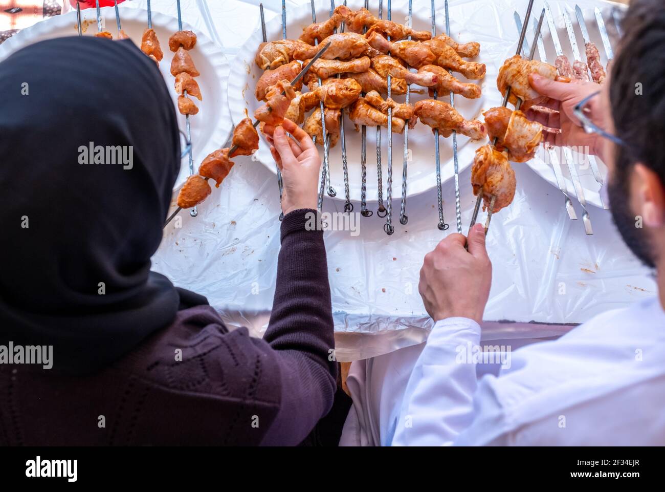 Arabic Muslim family preparing for barbeque Stock Photo - Alamy
