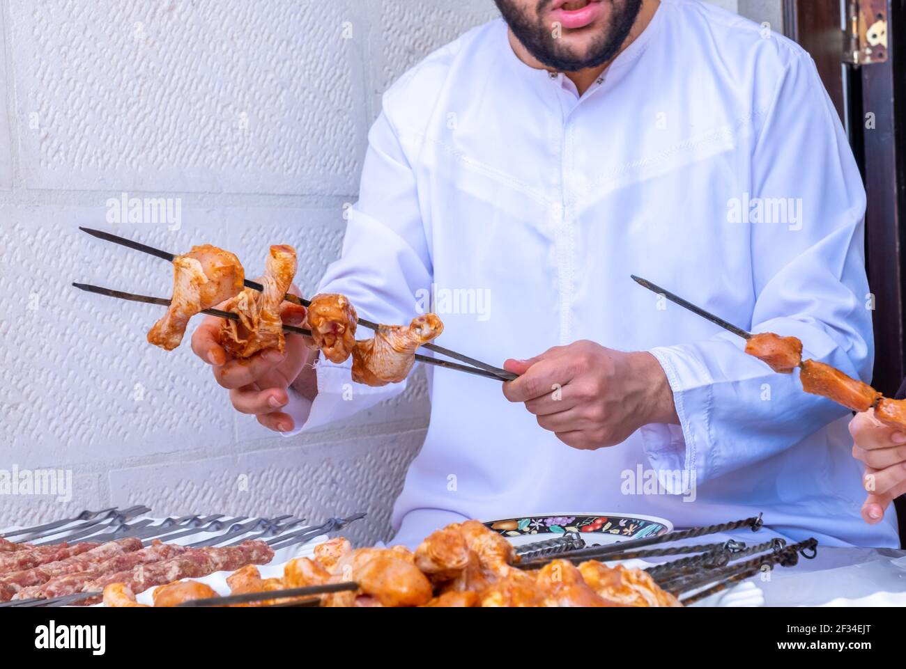 Arabic Muslim family preparing for barbeque Stock Photo - Alamy