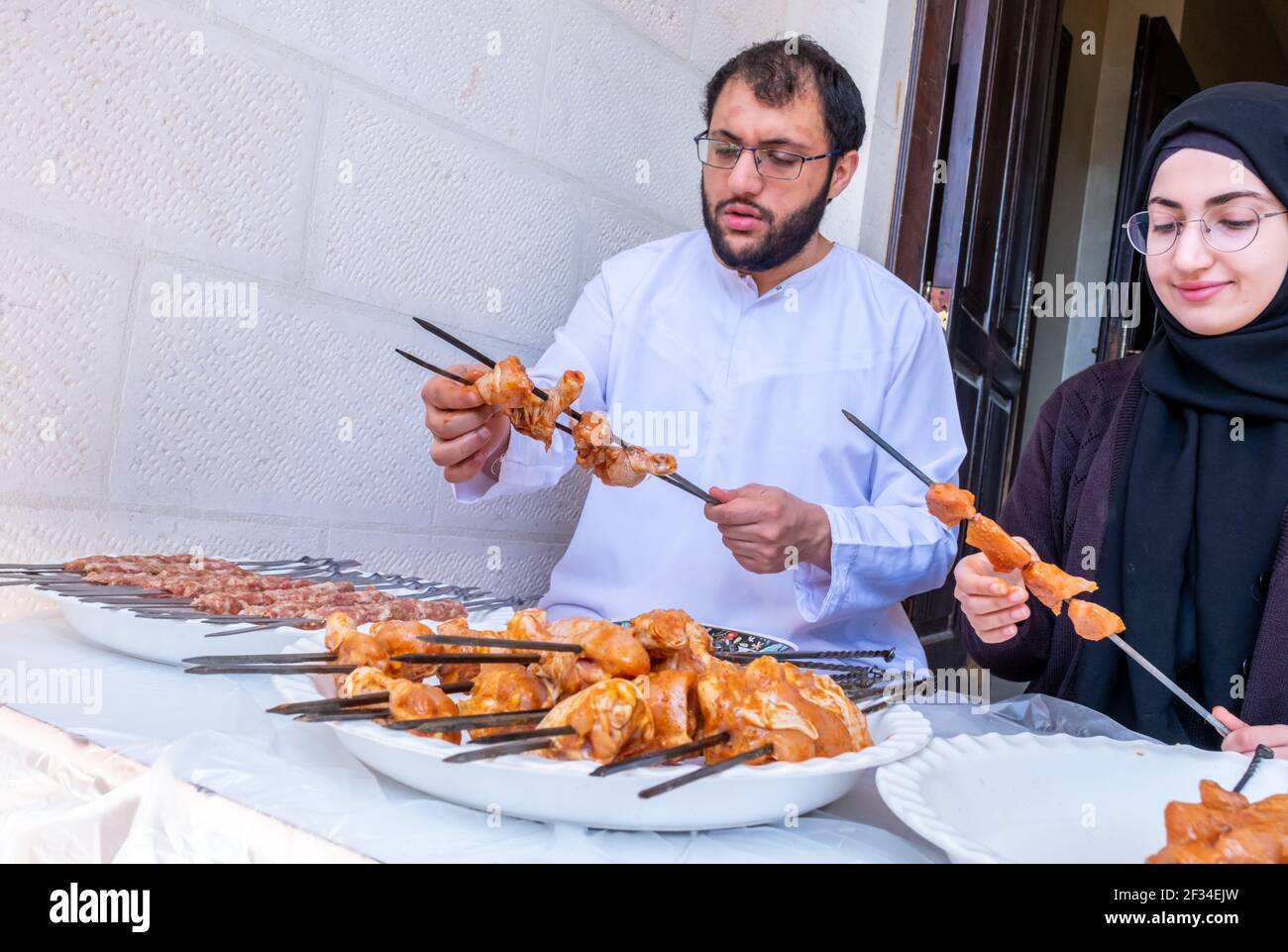 Arabic Muslim family preparing for barbeque Stock Photo - Alamy