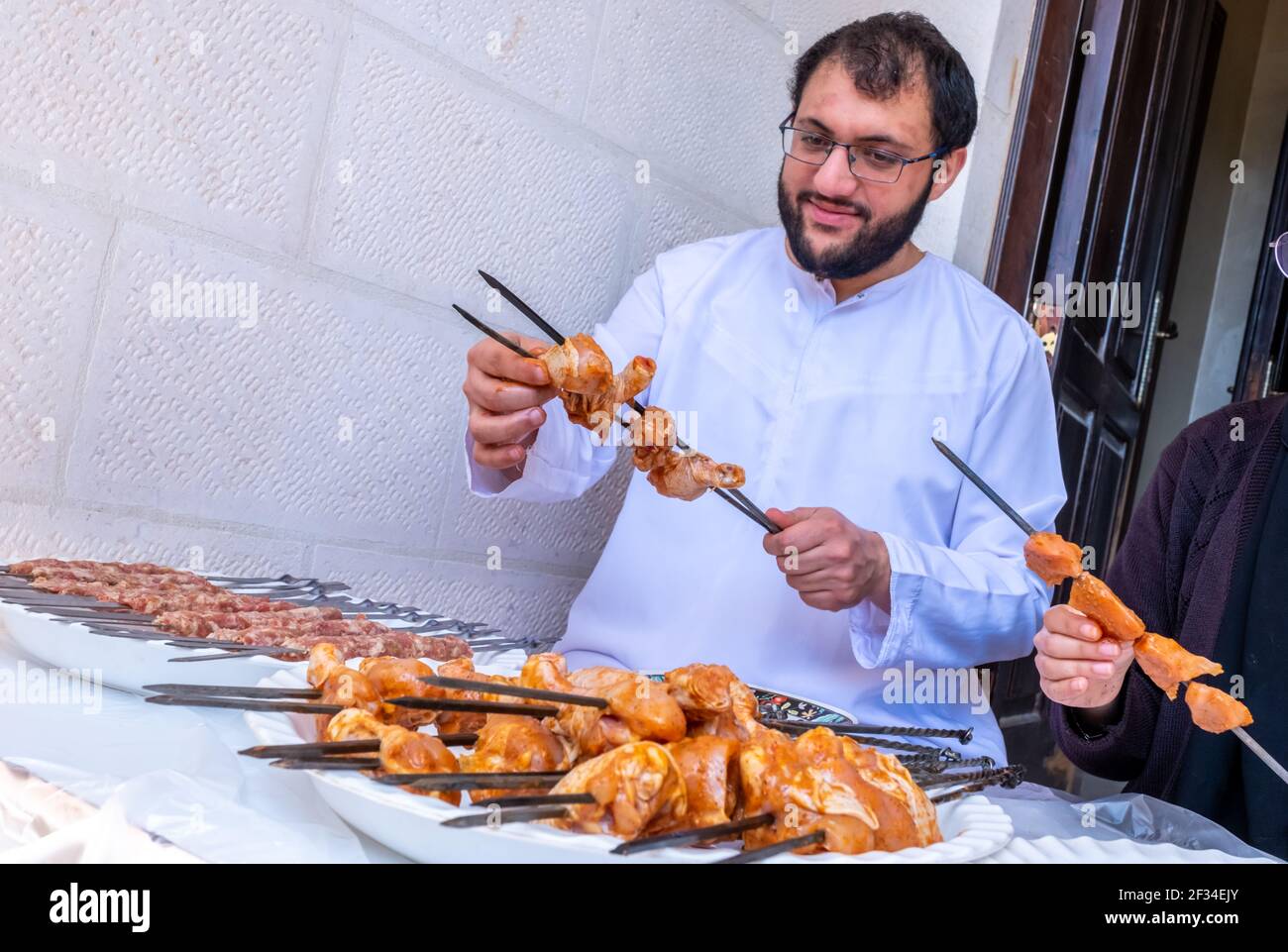 Arabic Muslim family preparing for barbeque Stock Photo - Alamy