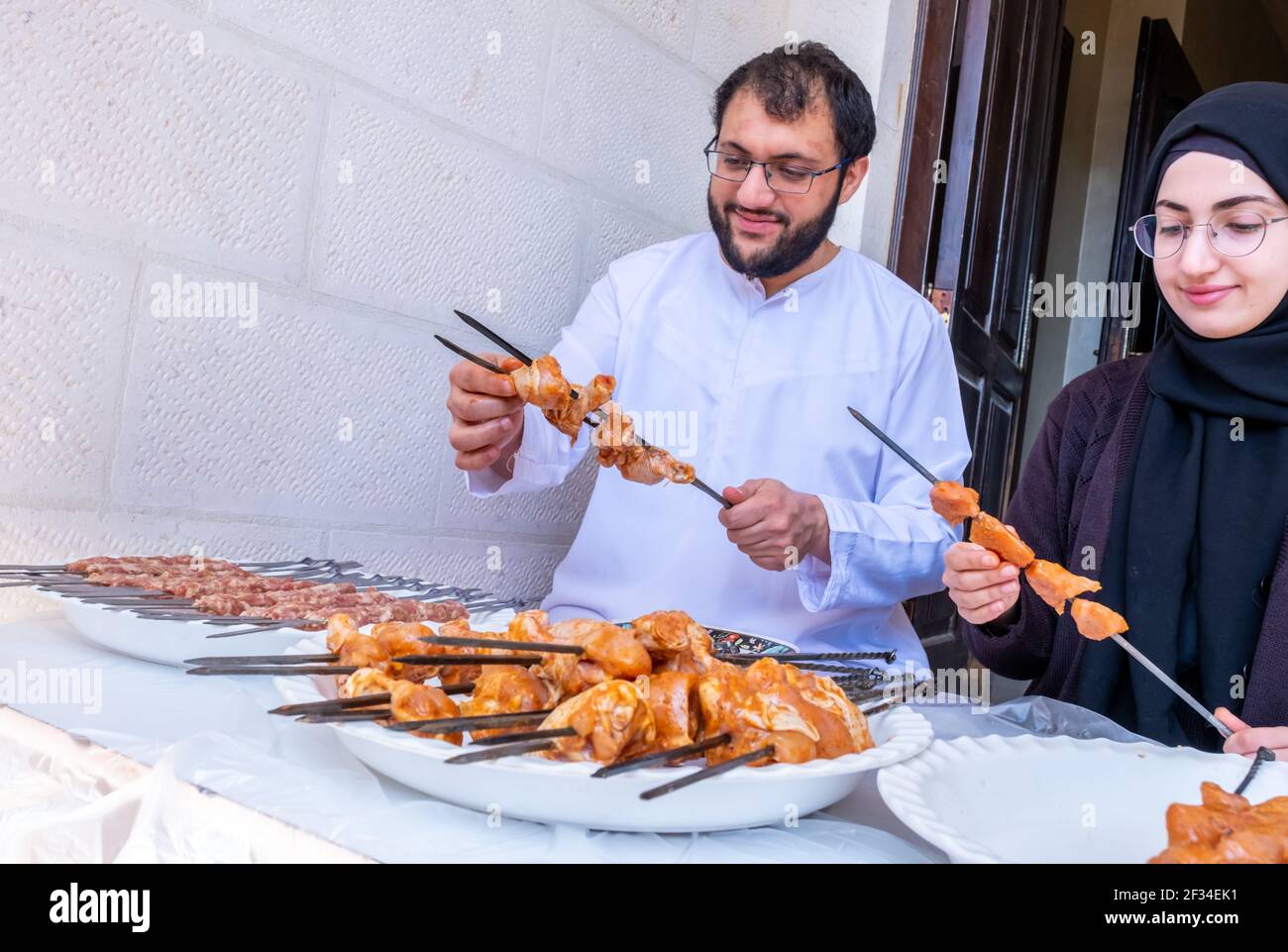 Arabic Muslim family preparing for barbeque Stock Photo - Alamy