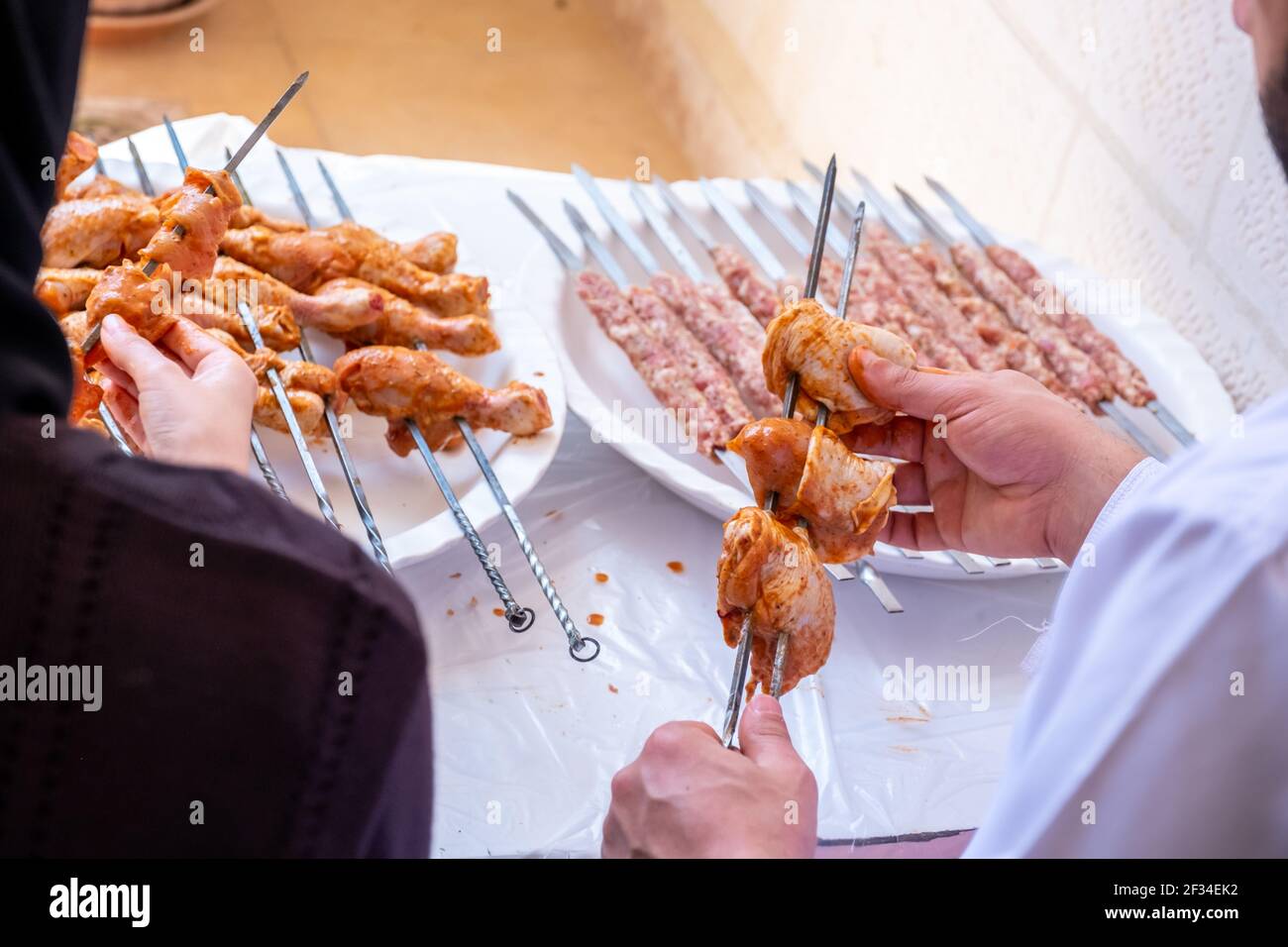 Arabic Muslim family preparing for barbeque Stock Photo - Alamy