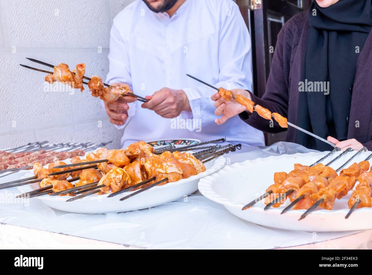 Arabic Muslim family preparing for barbeque Stock Photo - Alamy