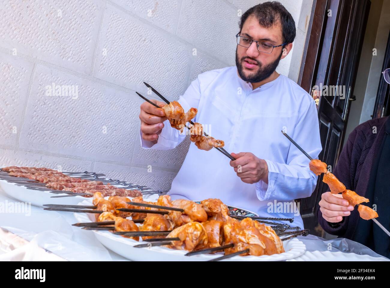 Arabic Muslim family preparing for barbeque Stock Photo - Alamy
