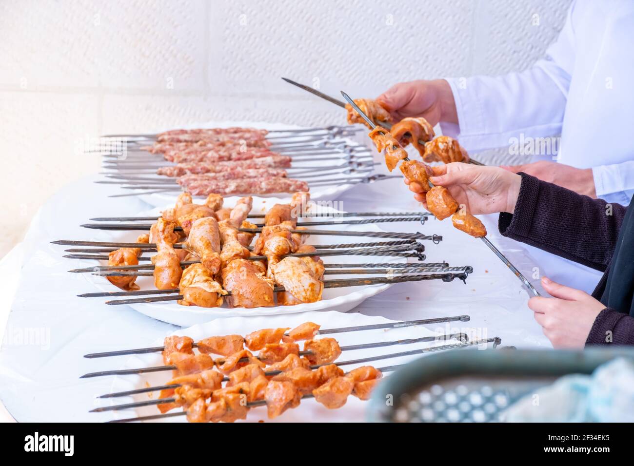 Arabic Muslim family preparing for barbeque Stock Photo - Alamy