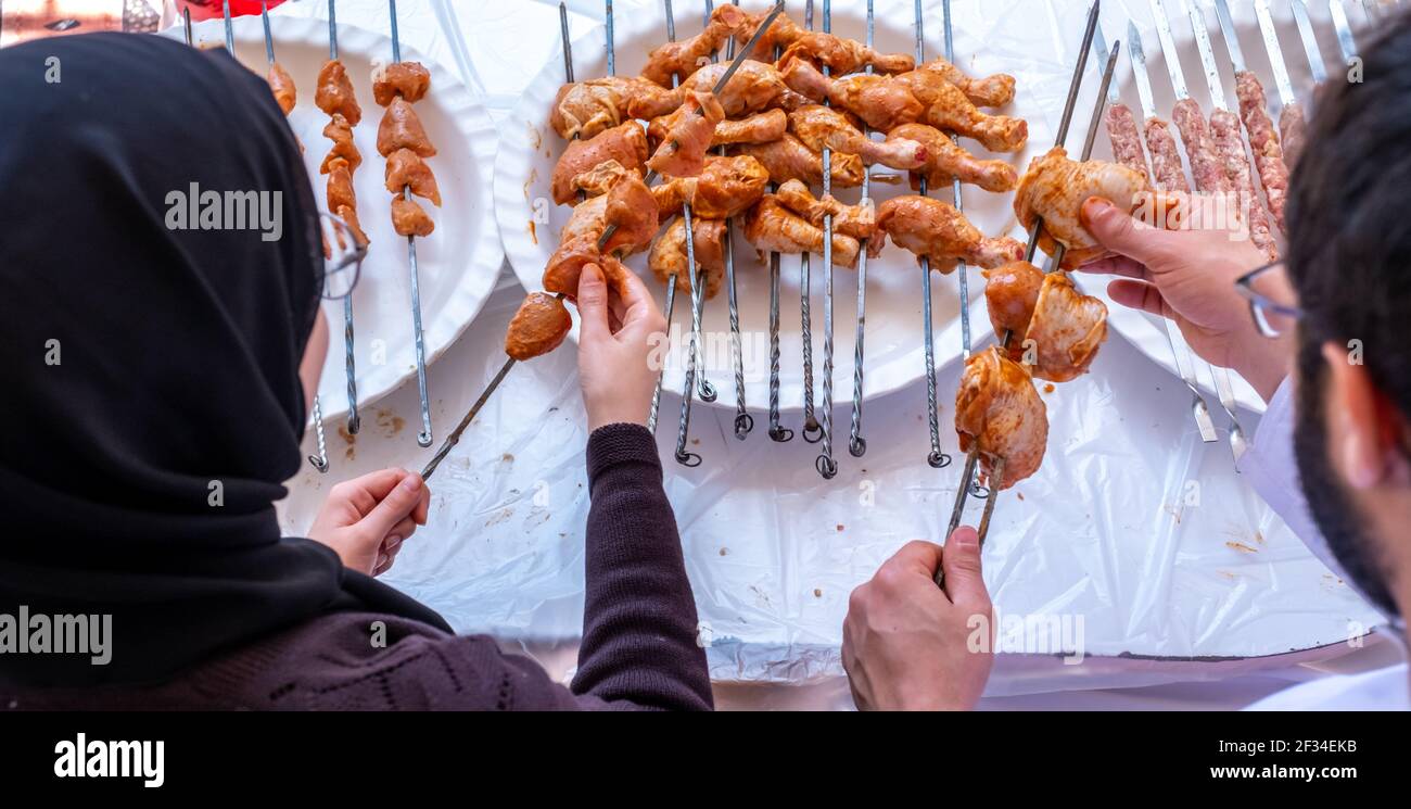 Arabic Muslim family preparing for barbeque Stock Photo - Alamy
