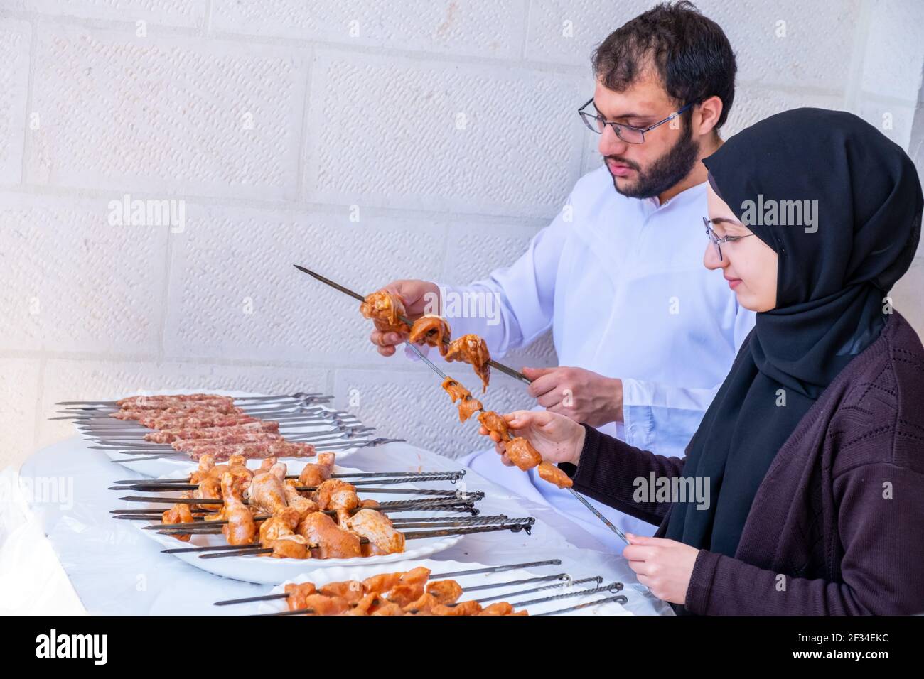 Arabic Muslim family preparing for barbeque Stock Photo - Alamy