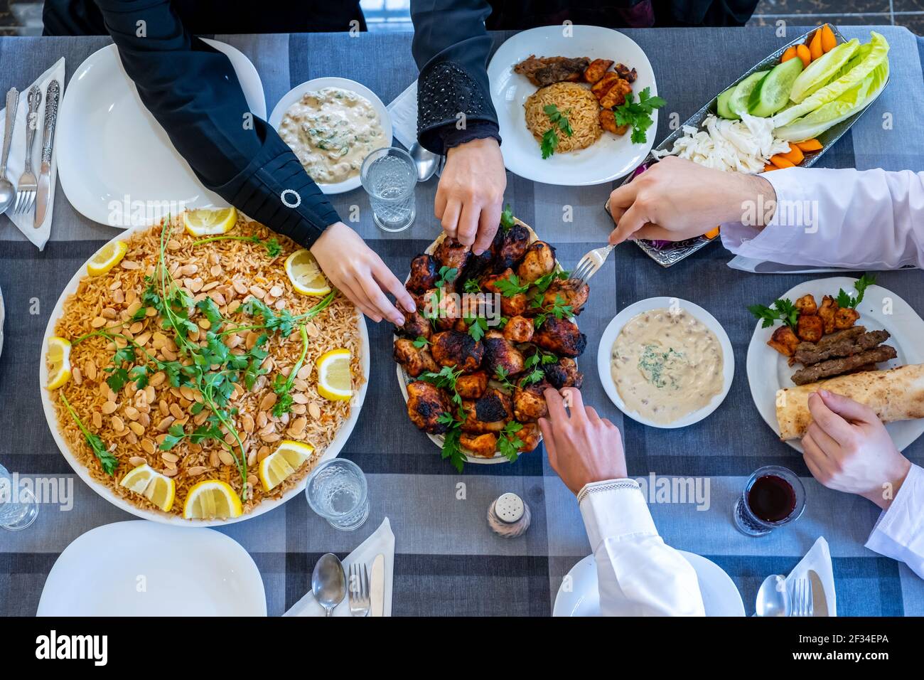happy Muslim family eating together Stock Photo - Alamy