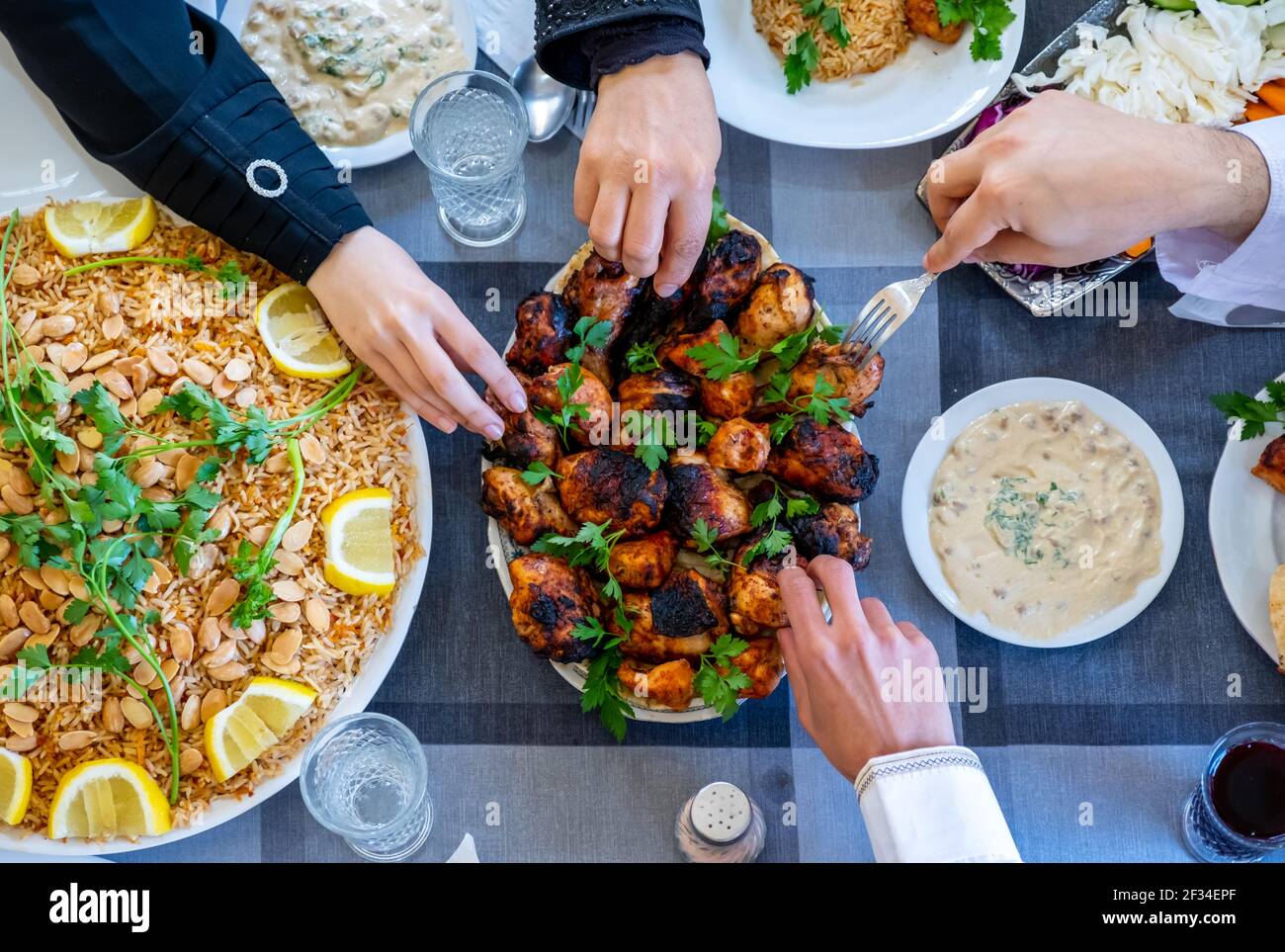 happy Muslim family eating together Stock Photo - Alamy