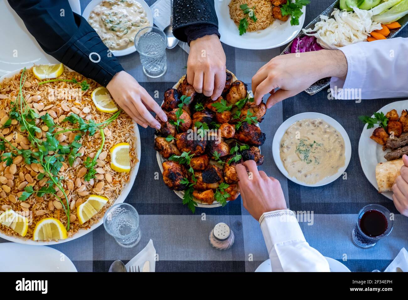 happy Muslim family eating together Stock Photo - Alamy