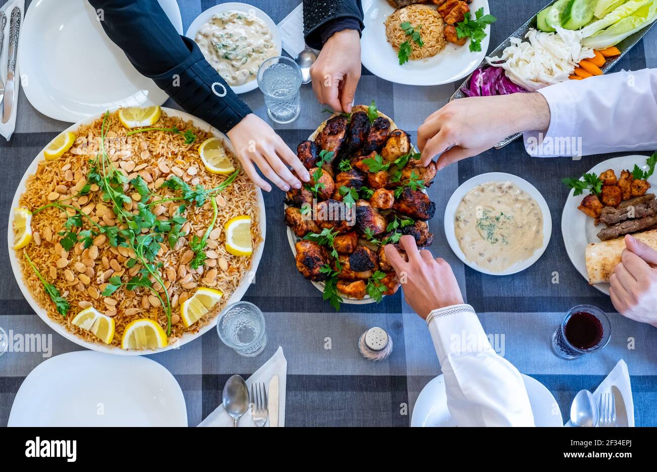 happy Muslim family eating together Stock Photo - Alamy