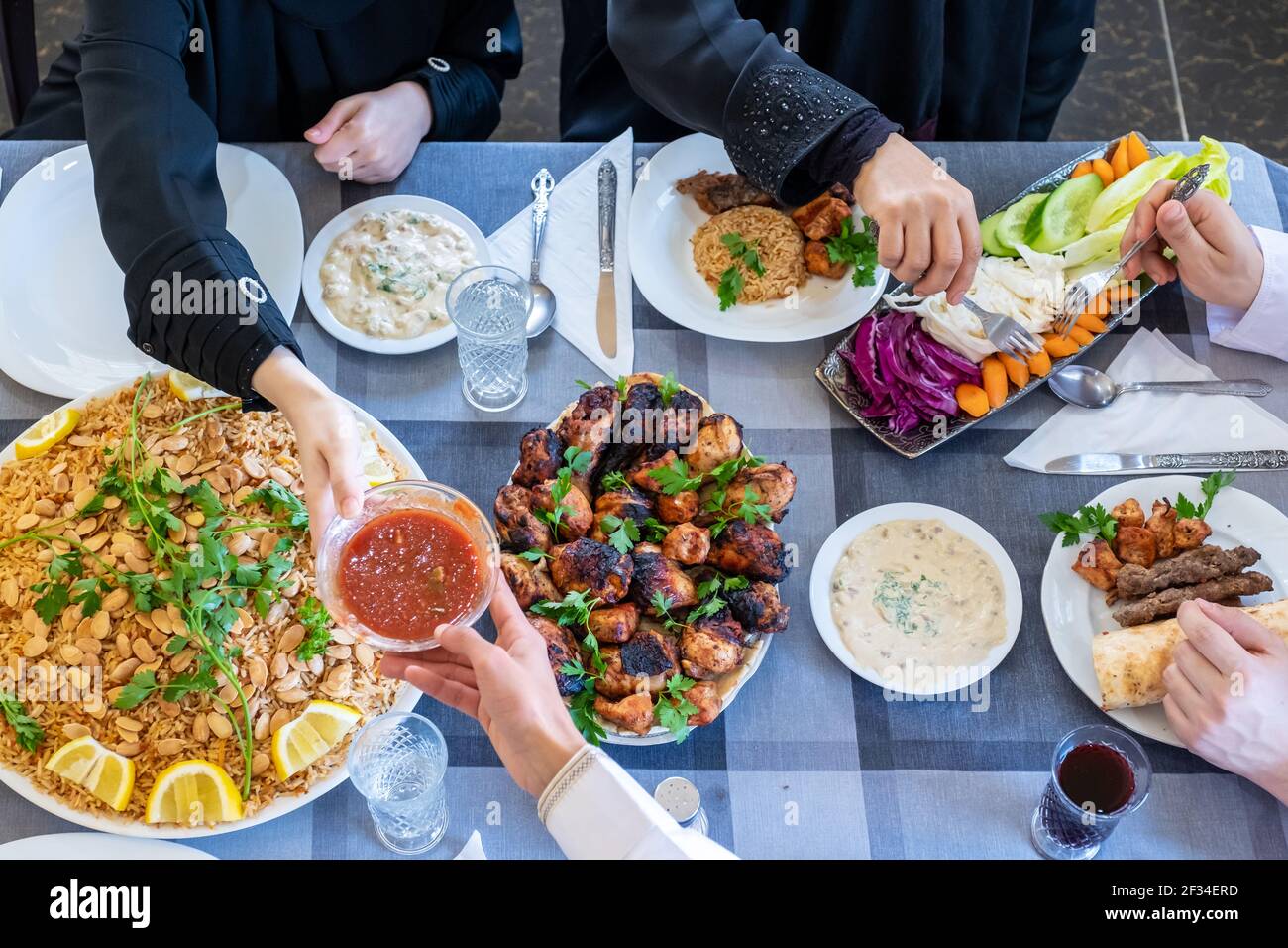 happy Muslim family eating together Stock Photo - Alamy
