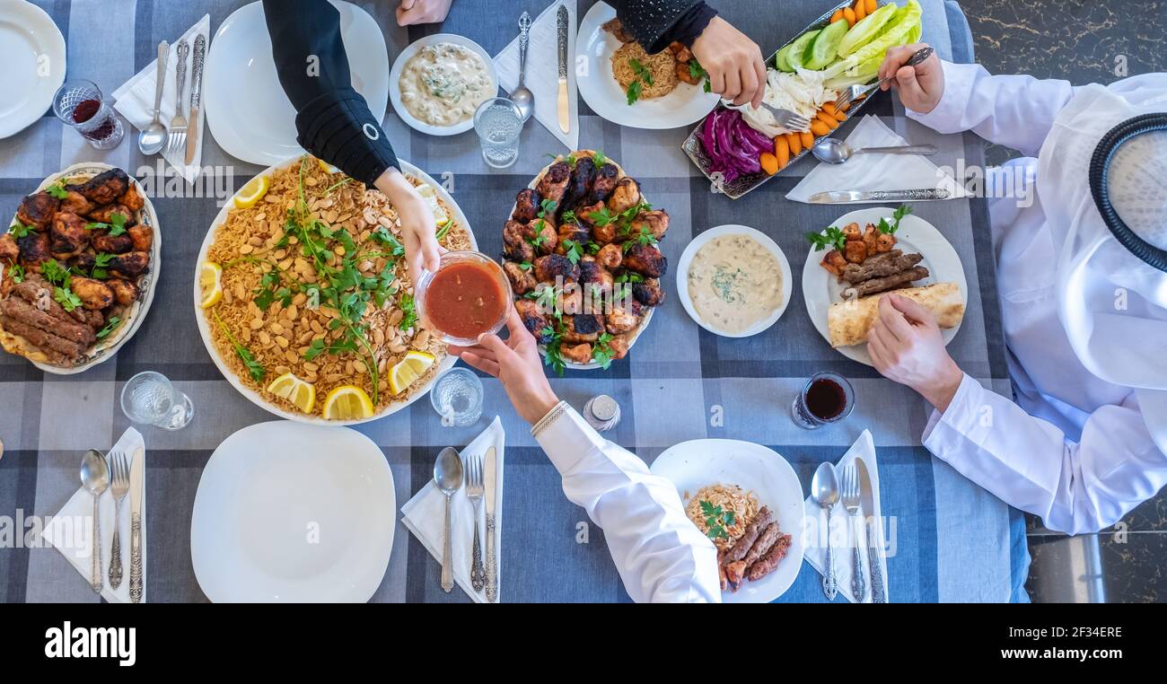 happy Muslim family eating together Stock Photo - Alamy