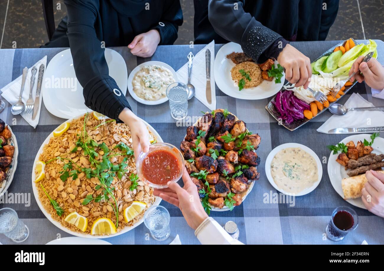 happy Muslim family eating together Stock Photo - Alamy