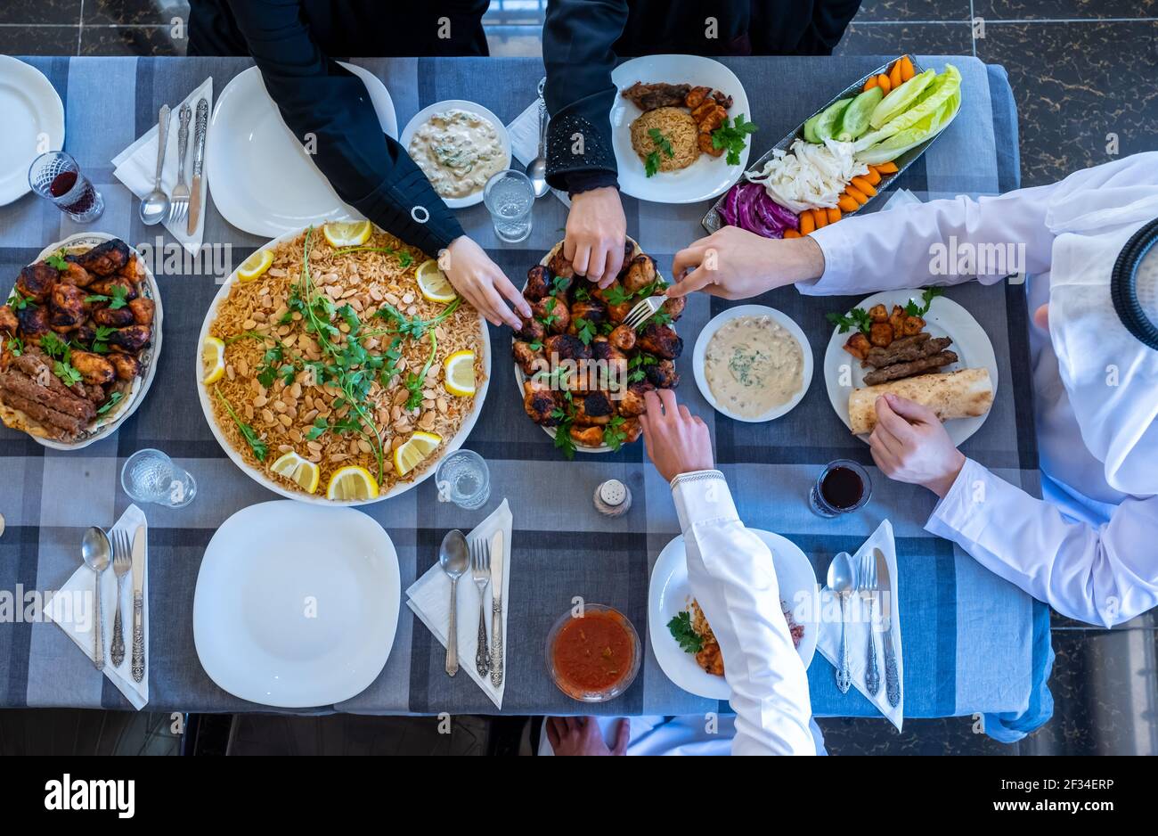 happy Muslim family eating together Stock Photo - Alamy