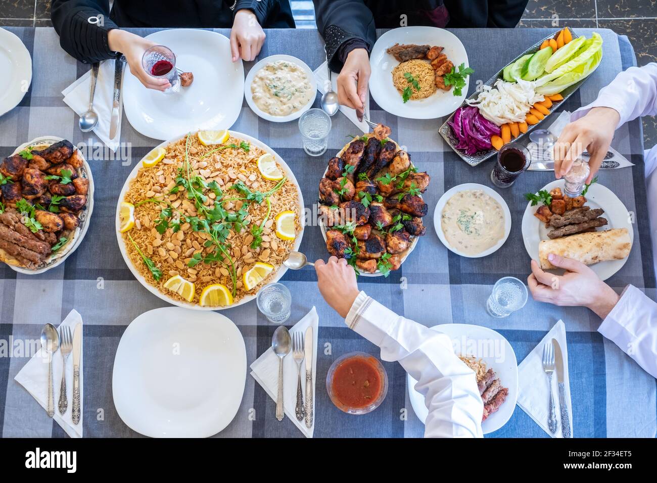 happy Muslim family eating together Stock Photo - Alamy