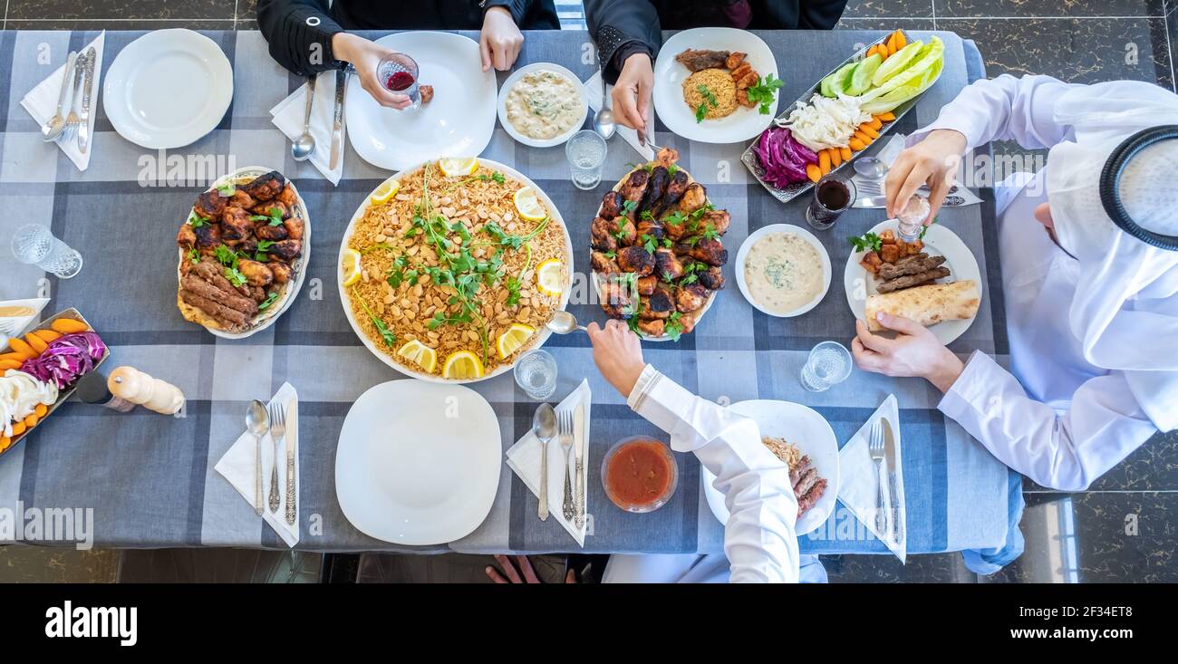 happy Muslim family eating together Stock Photo - Alamy