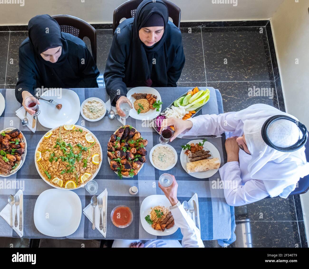 Happy arabic muslim family enjoying the food togther in ramadan Stock ...