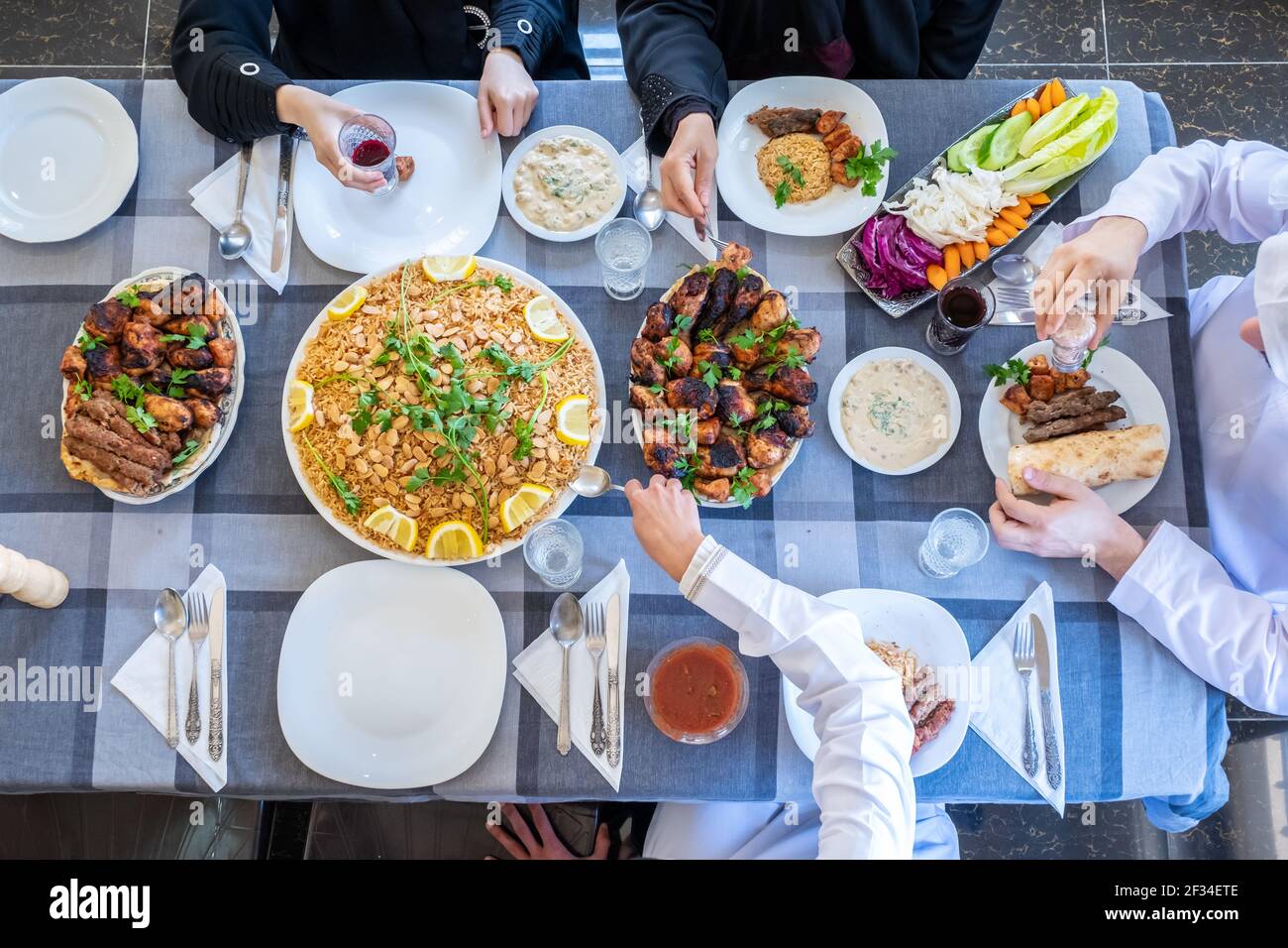 happy Muslim family eating together Stock Photo - Alamy