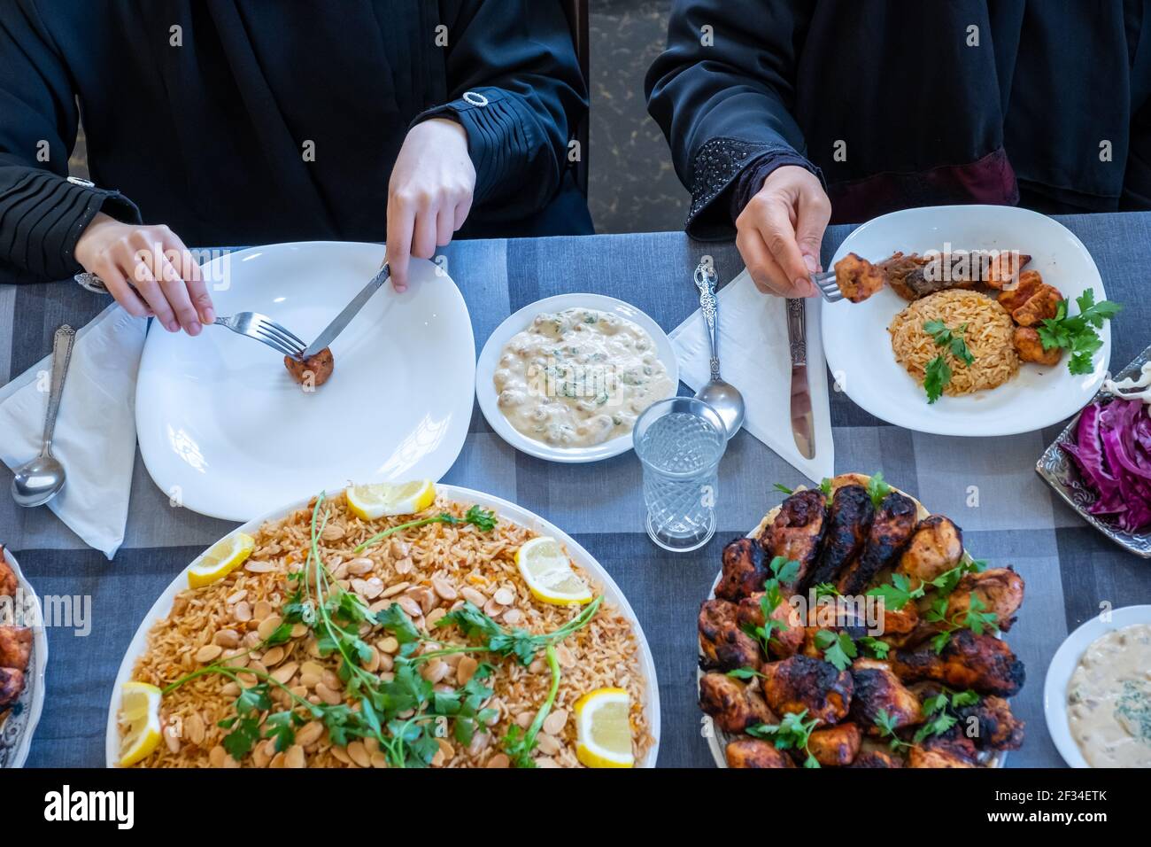 happy Muslim family eating together Stock Photo - Alamy