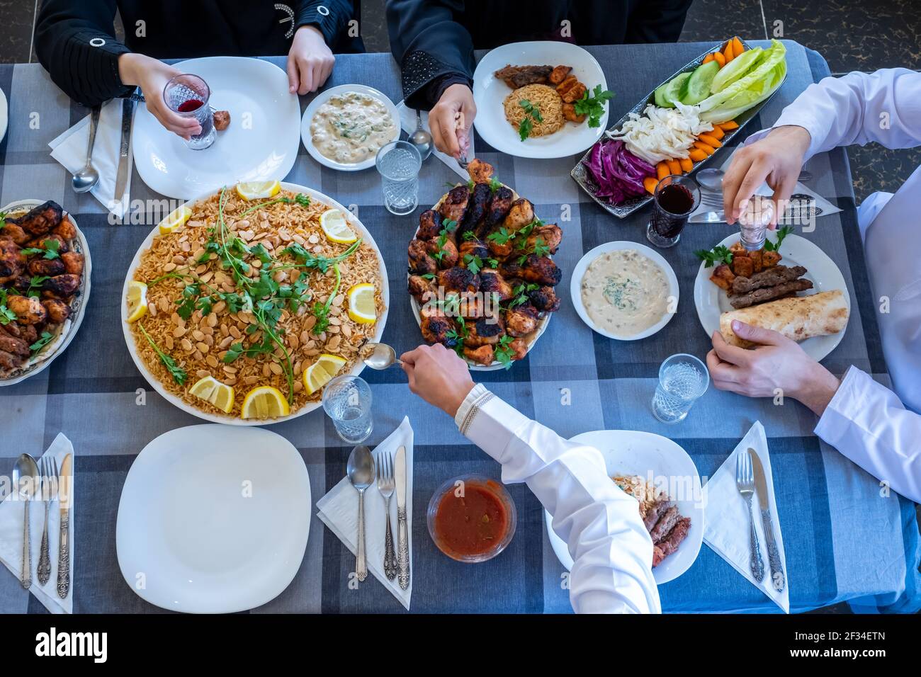 happy Muslim family eating together Stock Photo - Alamy
