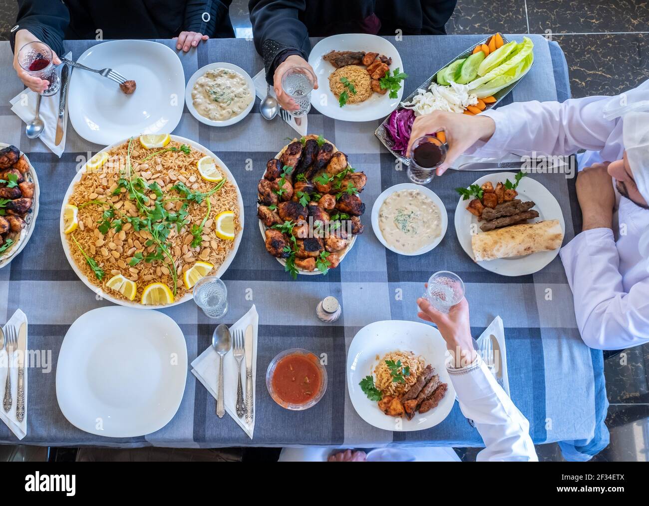 happy Muslim family eating together Stock Photo - Alamy