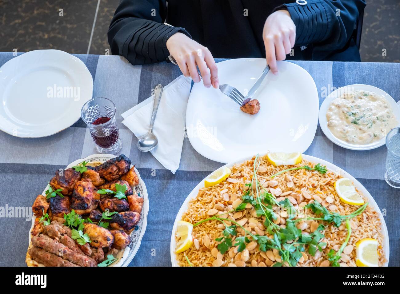 happy Muslim family eating together Stock Photo - Alamy