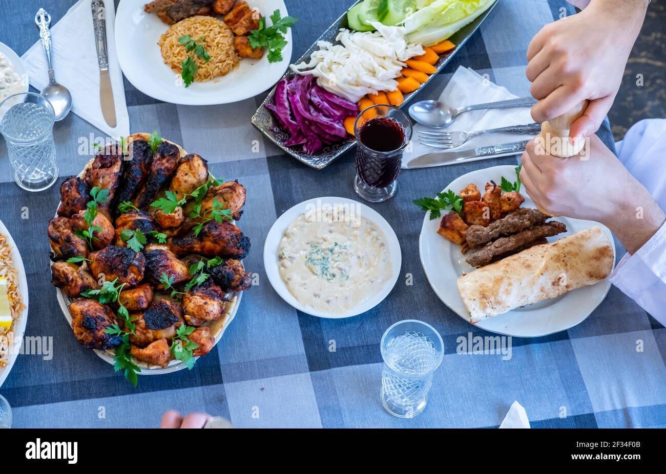 happy Muslim family eating together Stock Photo - Alamy
