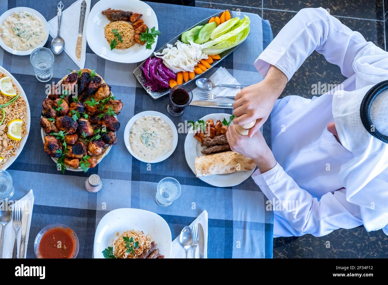 happy Muslim family eating together Stock Photo - Alamy