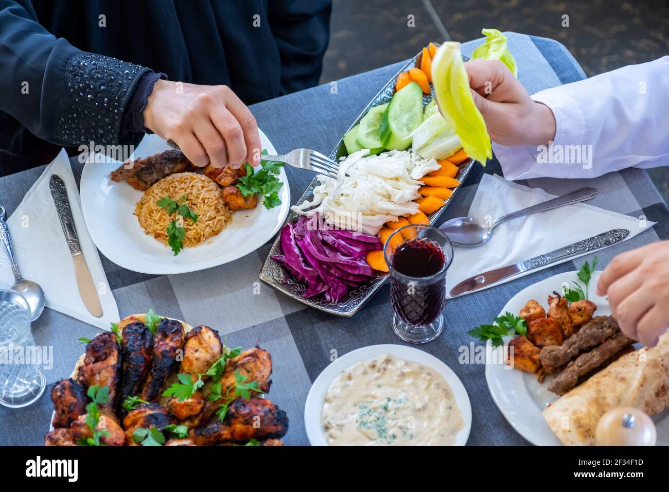 happy Muslim family eating together Stock Photo - Alamy