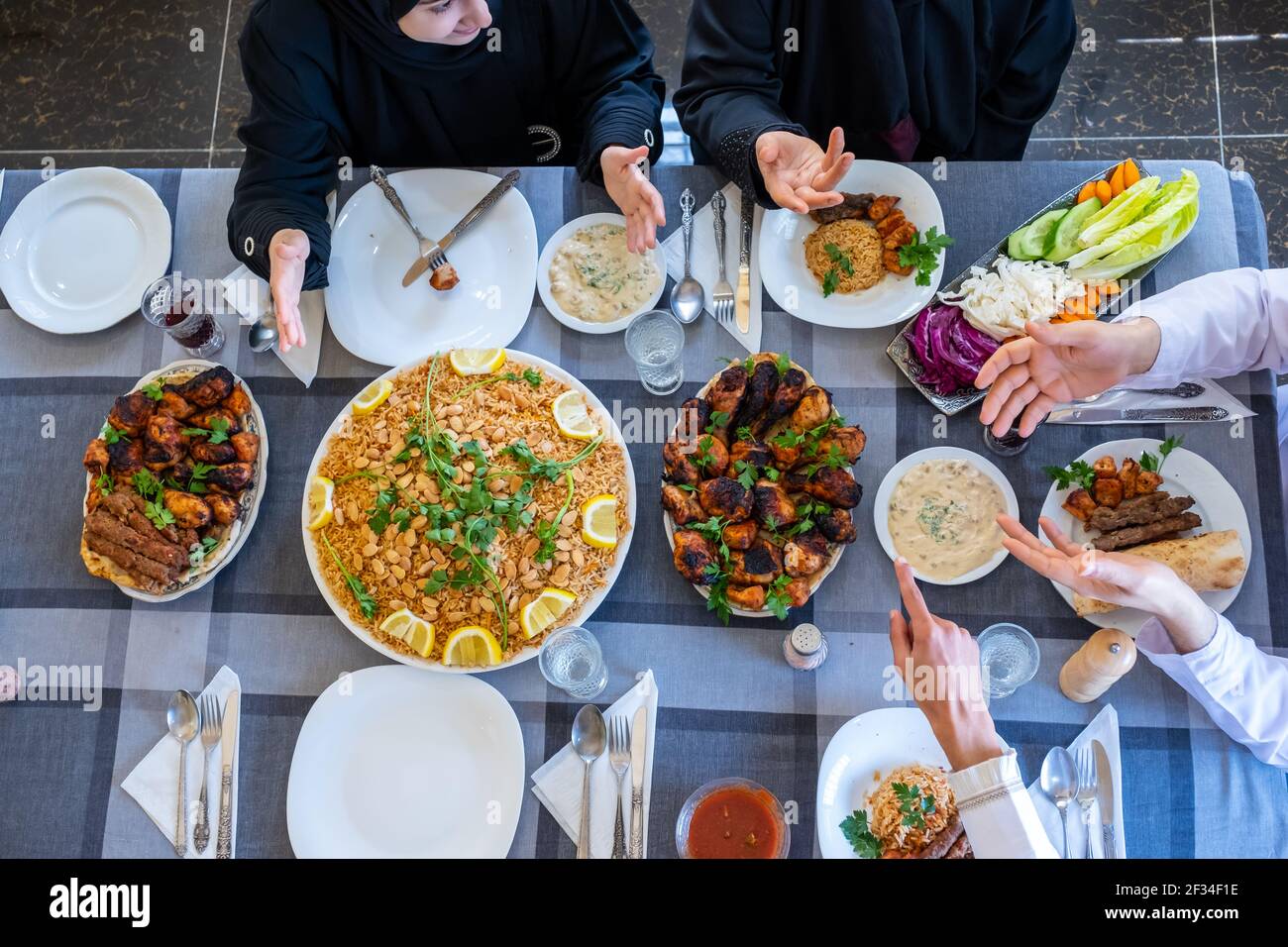 happy Muslim family eating together Stock Photo - Alamy
