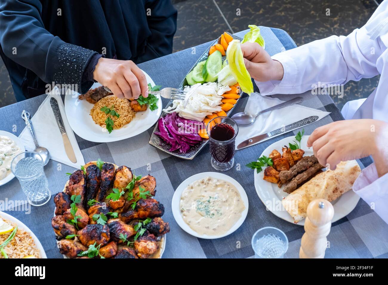 happy Muslim family eating together Stock Photo - Alamy