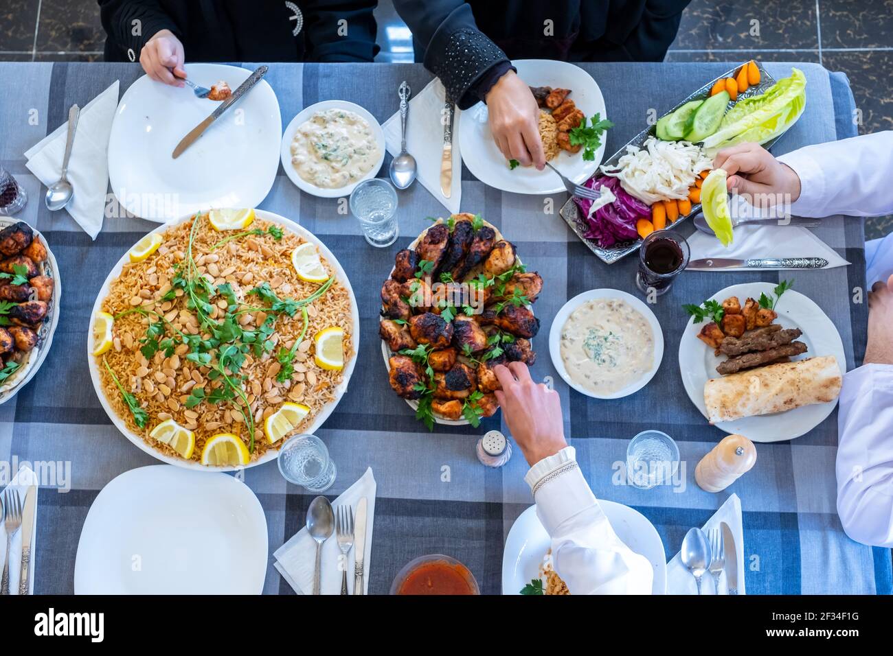 happy Muslim family eating together Stock Photo - Alamy