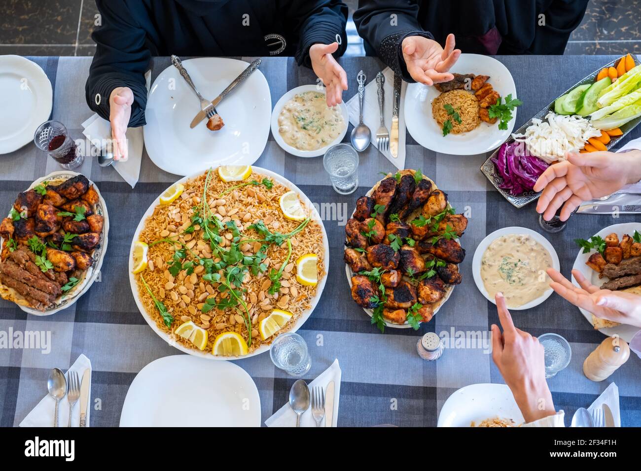 happy Muslim family eating together Stock Photo - Alamy