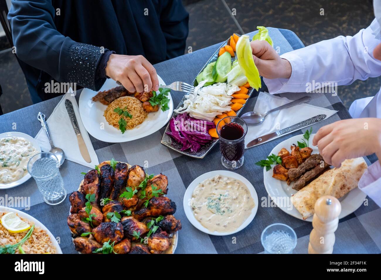 happy Muslim family eating together Stock Photo - Alamy