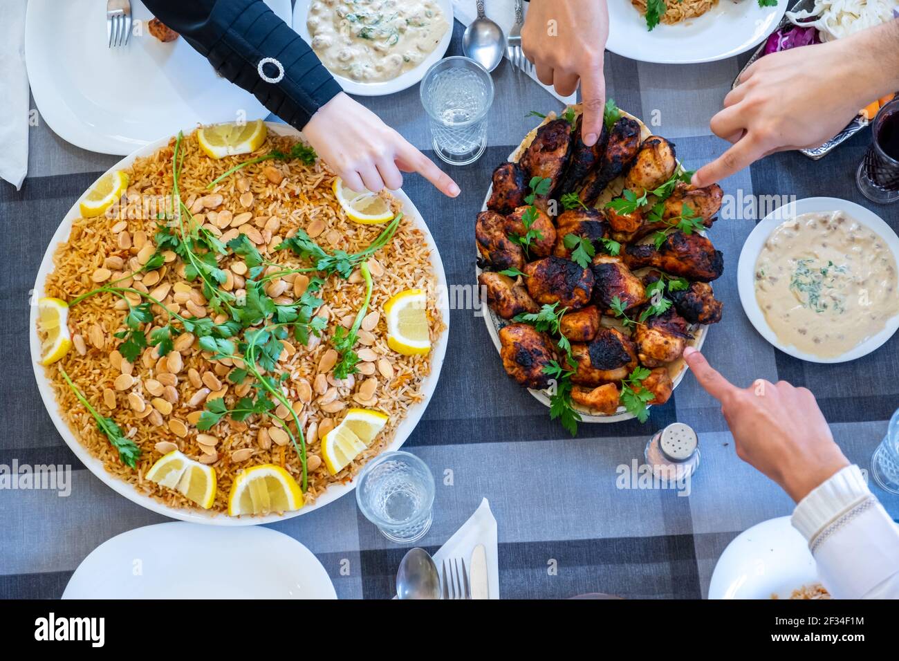 happy Muslim family eating together Stock Photo - Alamy