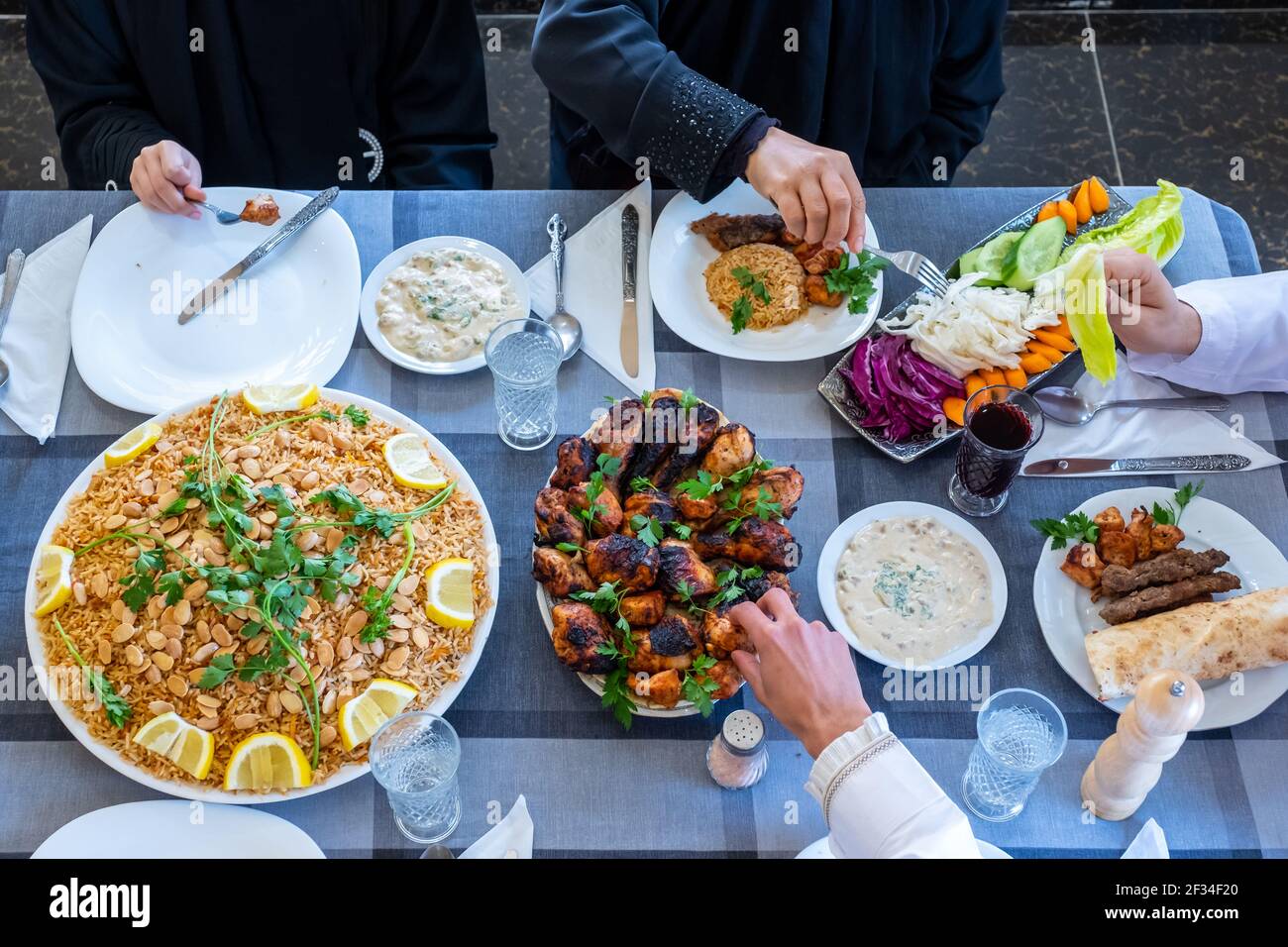 happy Muslim family eating together Stock Photo - Alamy