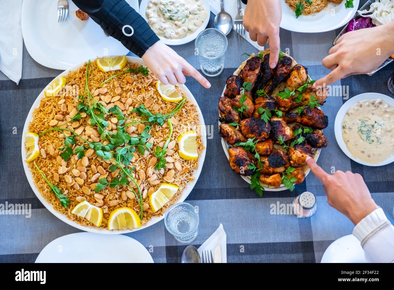 happy Muslim family eating together Stock Photo - Alamy