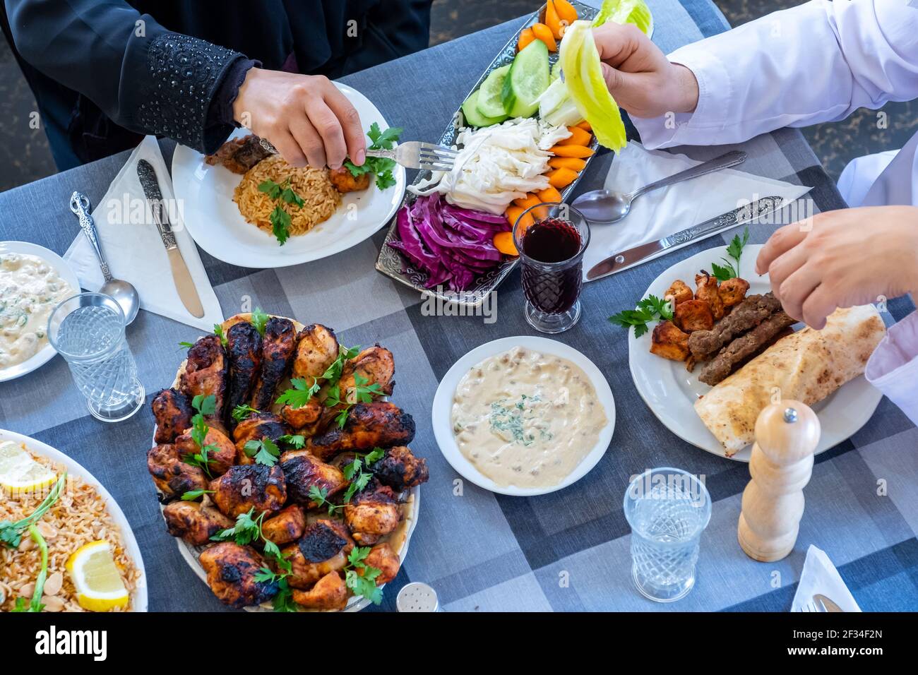 happy Muslim family eating together Stock Photo - Alamy