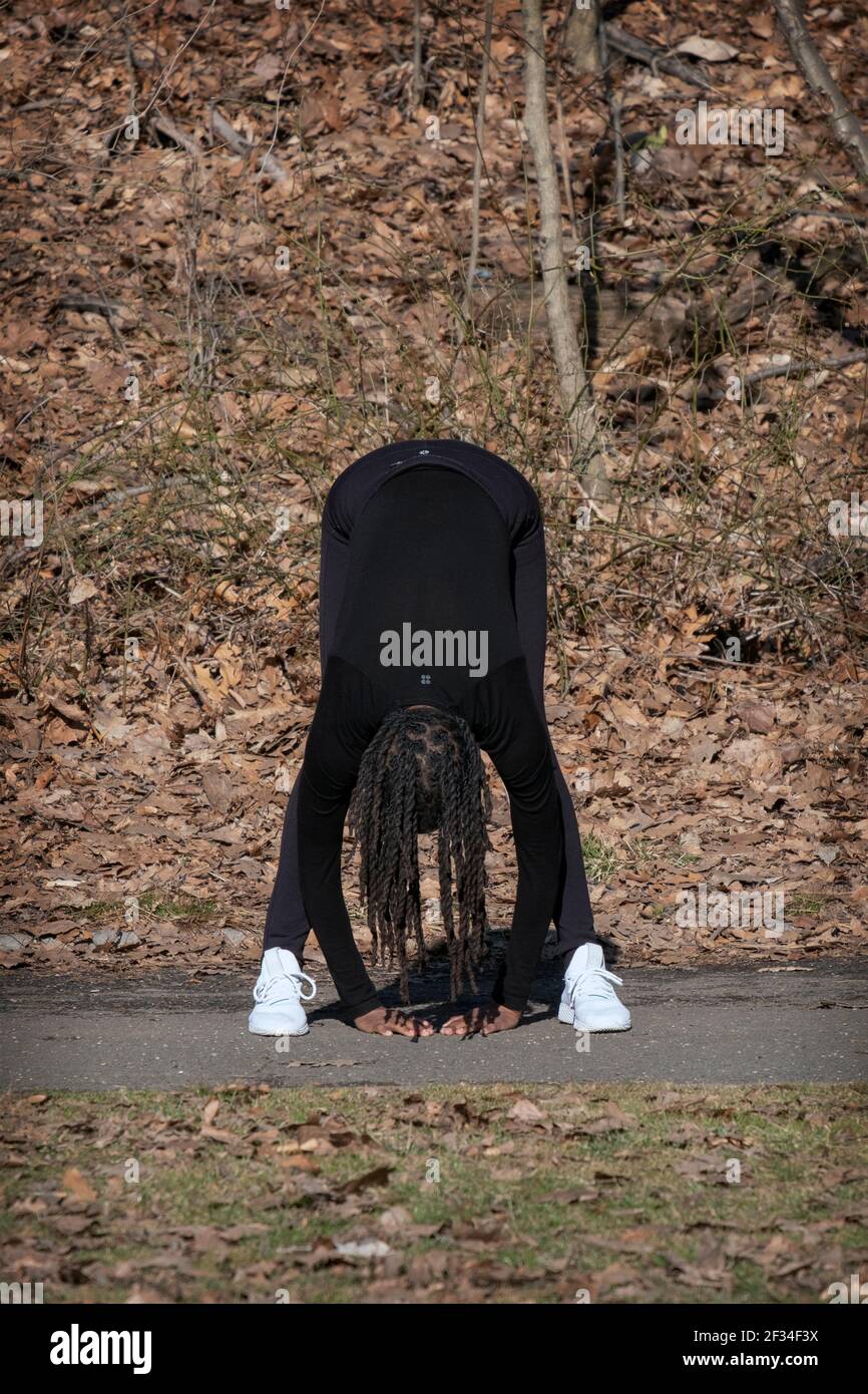 A nimble flexible woman in her fifties leads a daily meditative yoga ...