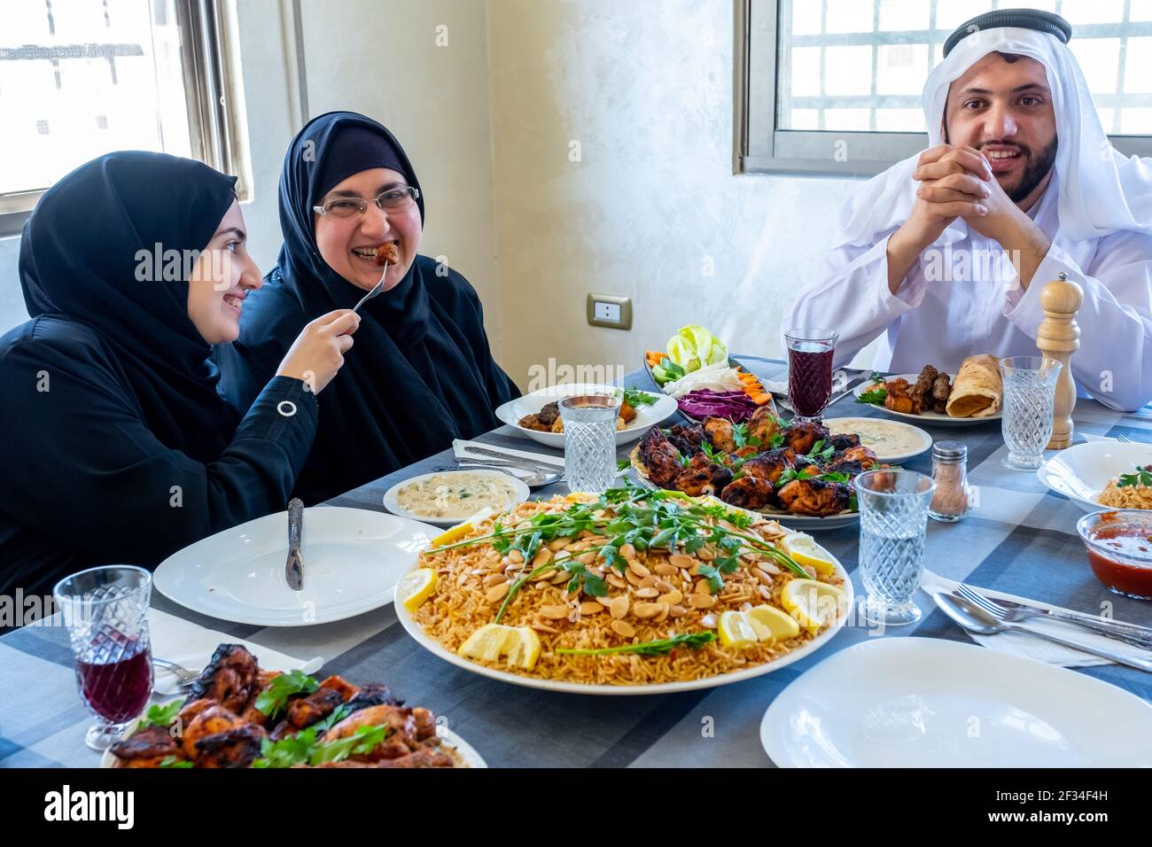 Happy arabic muslim family enjoying the food togther in ramadan Stock ...