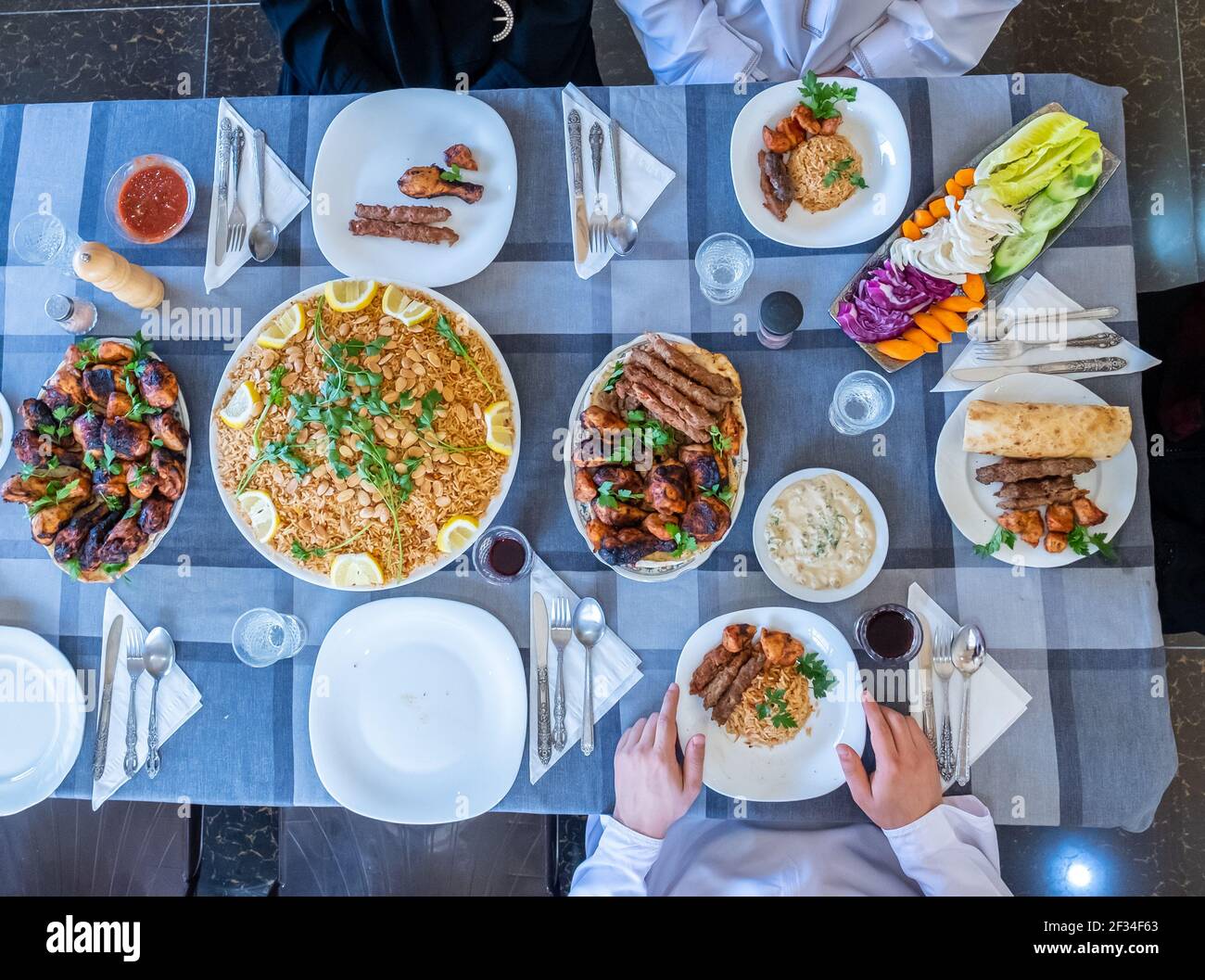 happy Muslim family eating together Stock Photo - Alamy