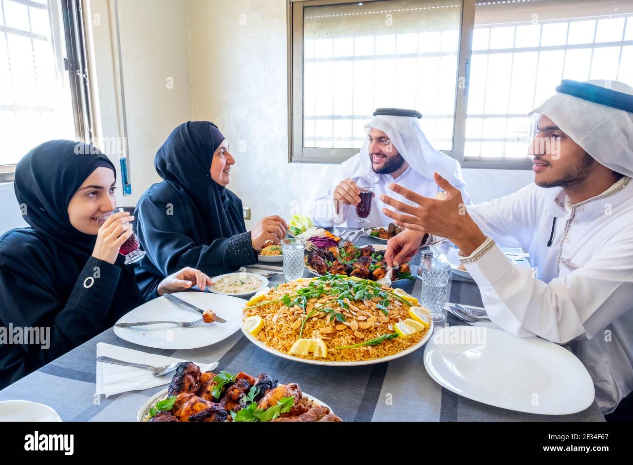 Happy arabic muslim family enjoying the food togther in ramadan Stock ...